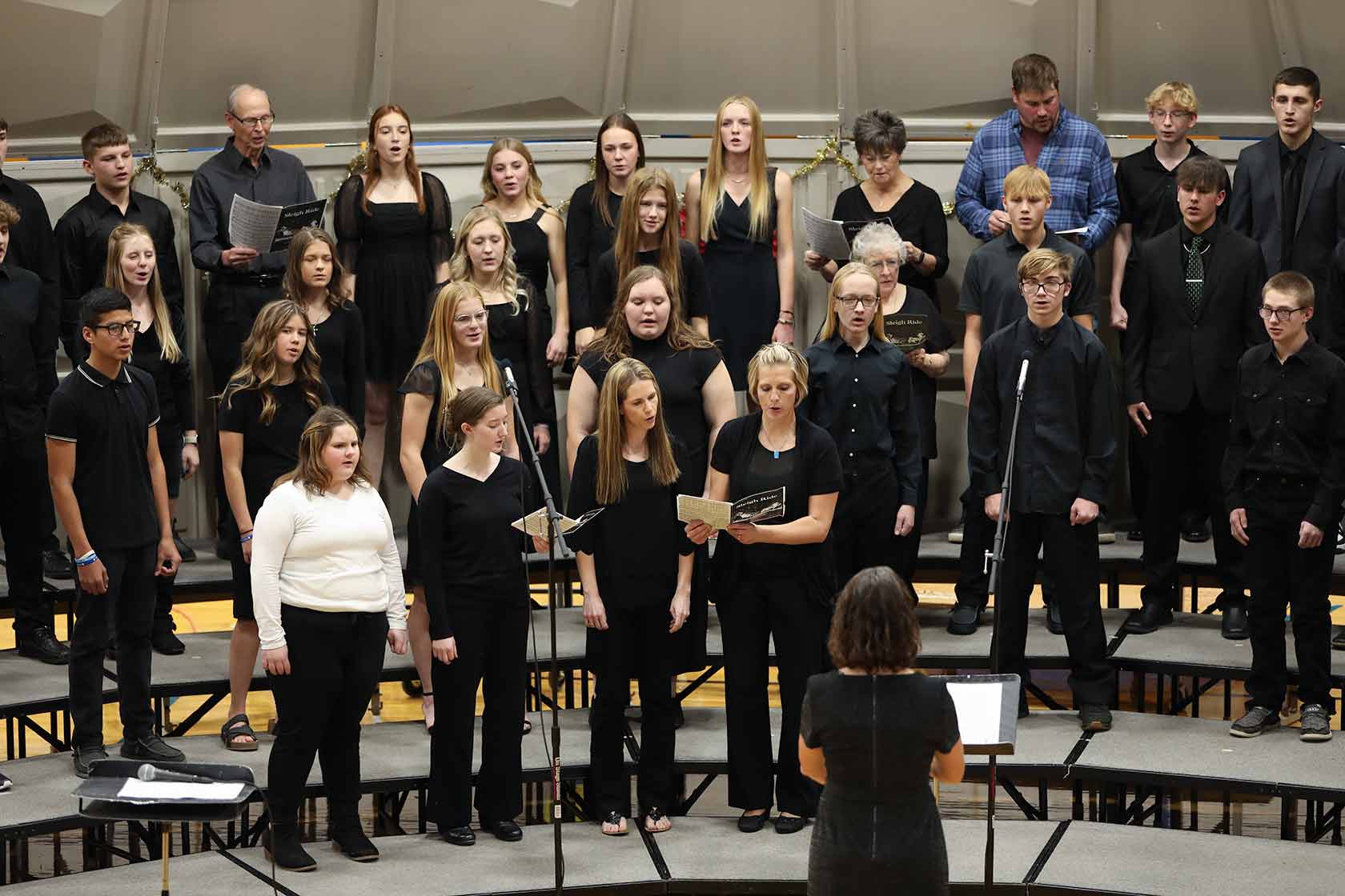 Students raise holiday spirit and voices in song at winter concerts ...